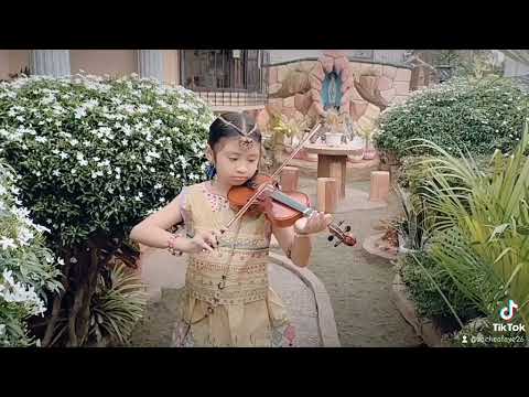 playing violin with her ethnic wear