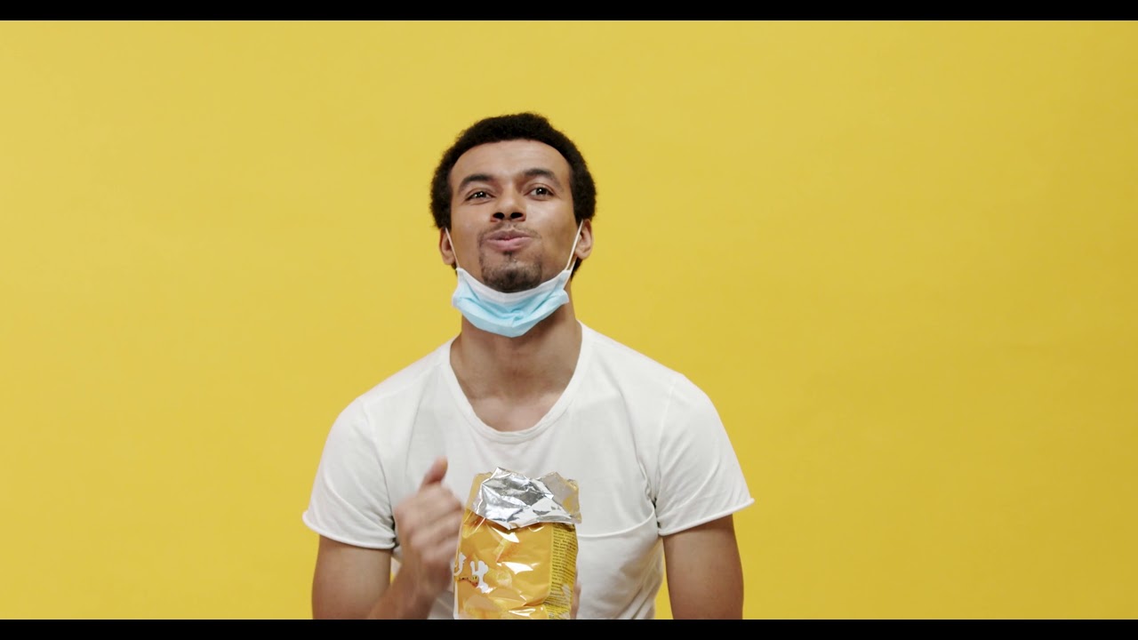 A Man Pulling Down His Mask To Eat Junk Food - Copyright Free | Stock ...