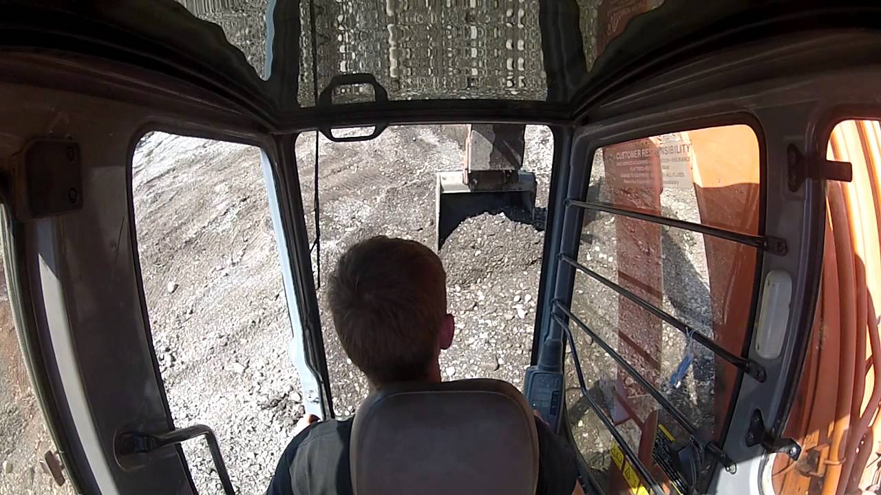 Cleaning up after flooding on the Morley Reserve in the Hitachi Zx 200 ...