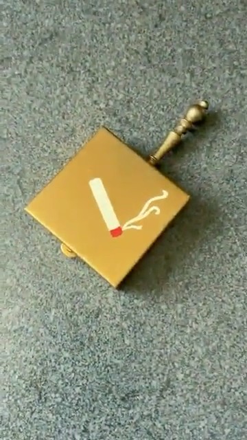 Tiny portable ashtray with spring-loaded cigarette rest - YouTube
