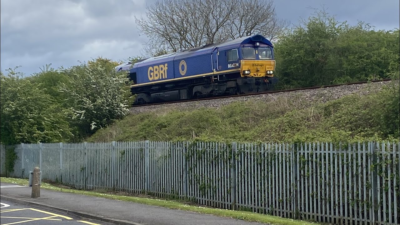 66797 “Beacon” with 20 Wascosa yellow ballast wagons 14:04 57E Carr ...