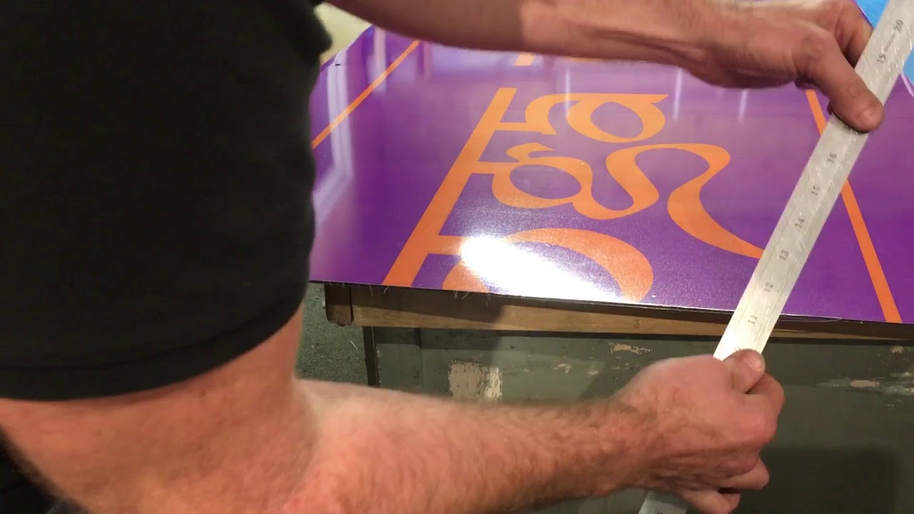 Finishing a vinyl edge on a composite sign panel - YouTube