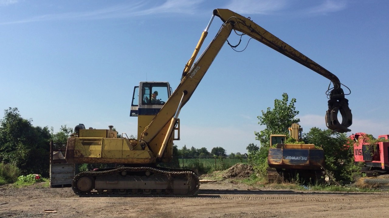 Komatsu PC 300 HD with Norris arm and fixed cab riser - YouTube