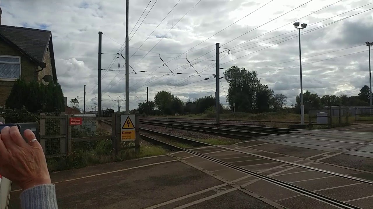 BR Britannia 4-6-2 no 70013 Oliver Cromwell passes Maxey Level Crossing ...