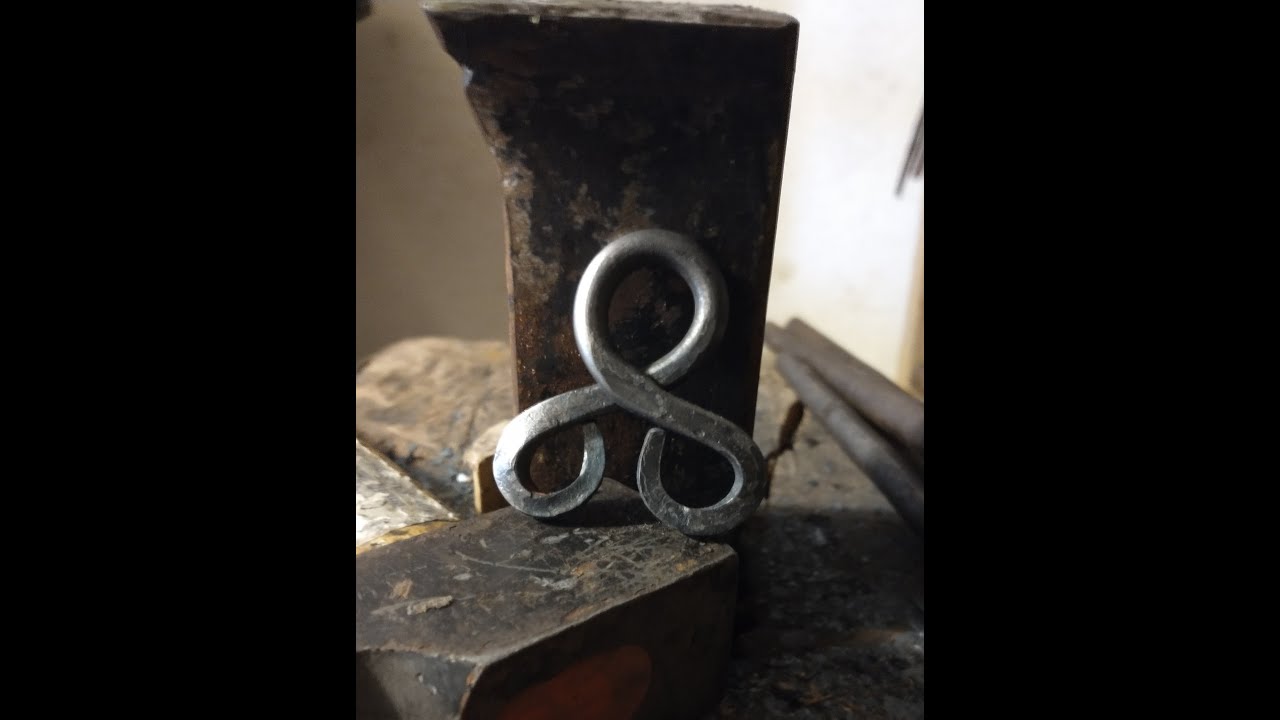 troll cross blacksmithing on my Viking anvil. - YouTube