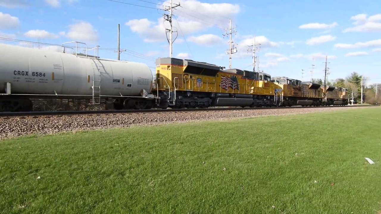 UP 8600 a SD70ACe with 2 SD70AH's lead a manifest east through Geneva IL - YouTube