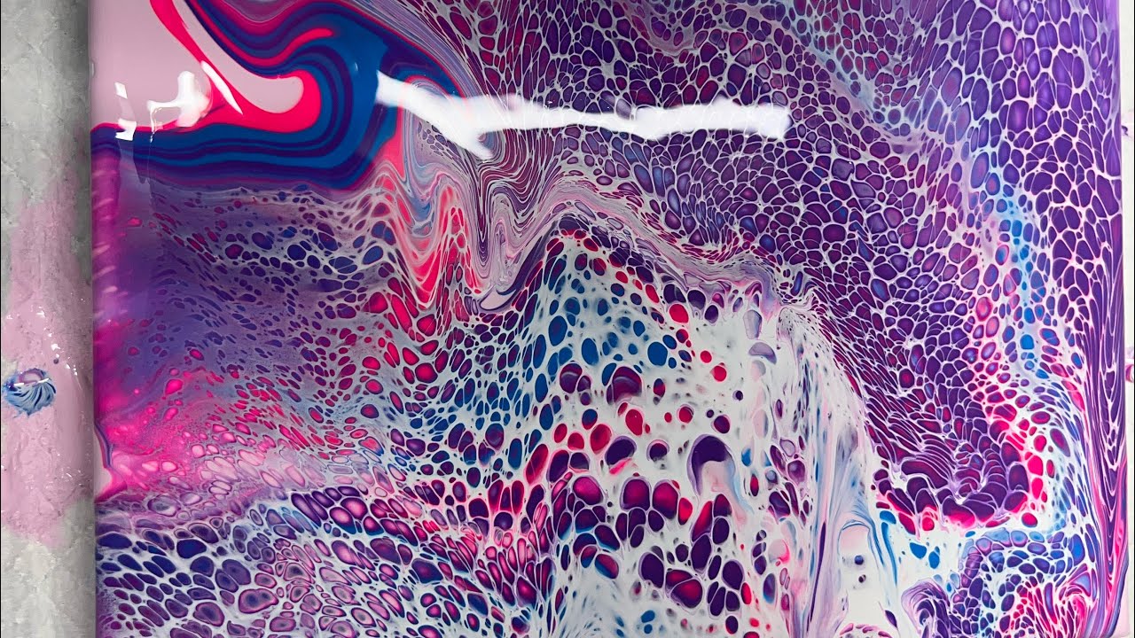 A puddle pour and swipe technique, using some fluorescent paints ...