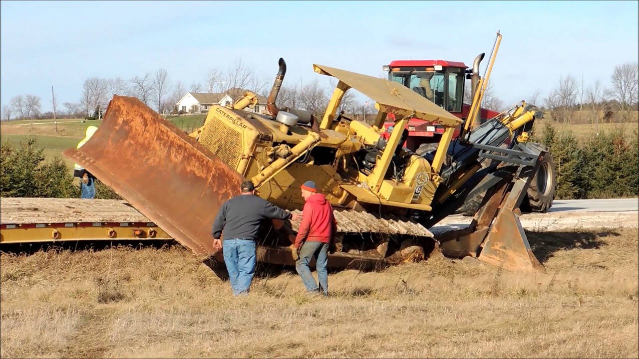 Unfortunate Mishap: Bulldozer Slips Off Transport Truck - What Went ...