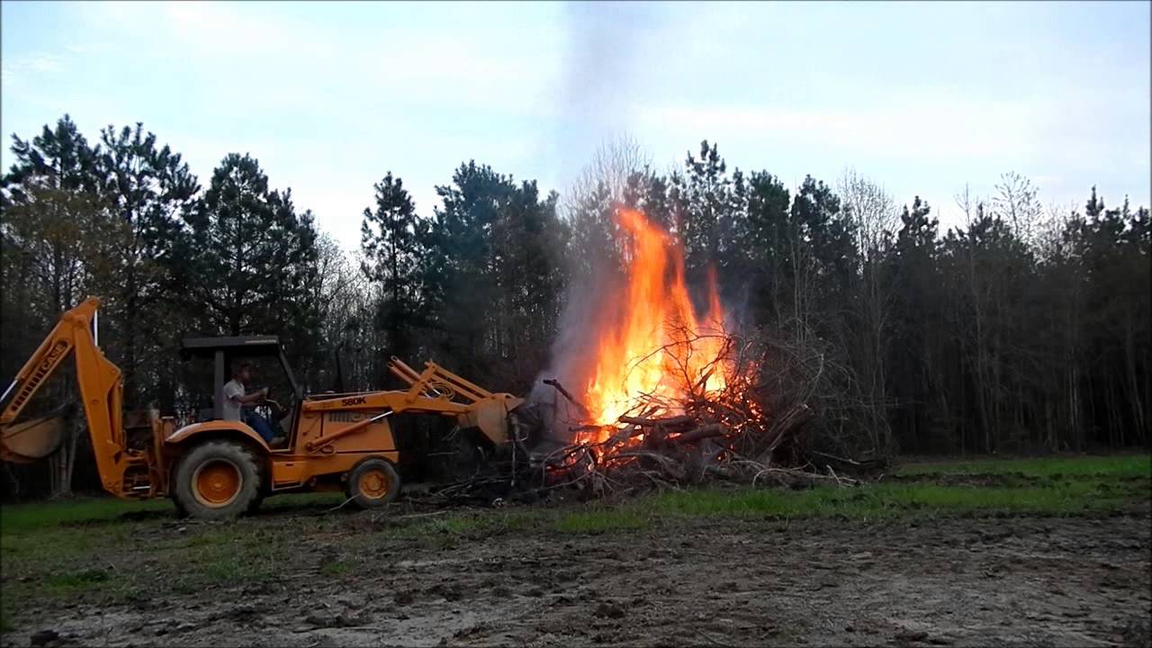 Case 580k Backhoe Pushing Up The Fire - YouTube