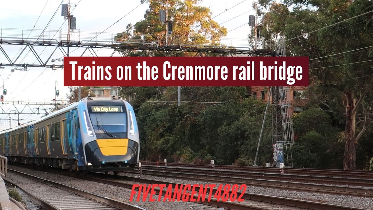 Trains on the Cremorne rail bridge at dusk - YouTube