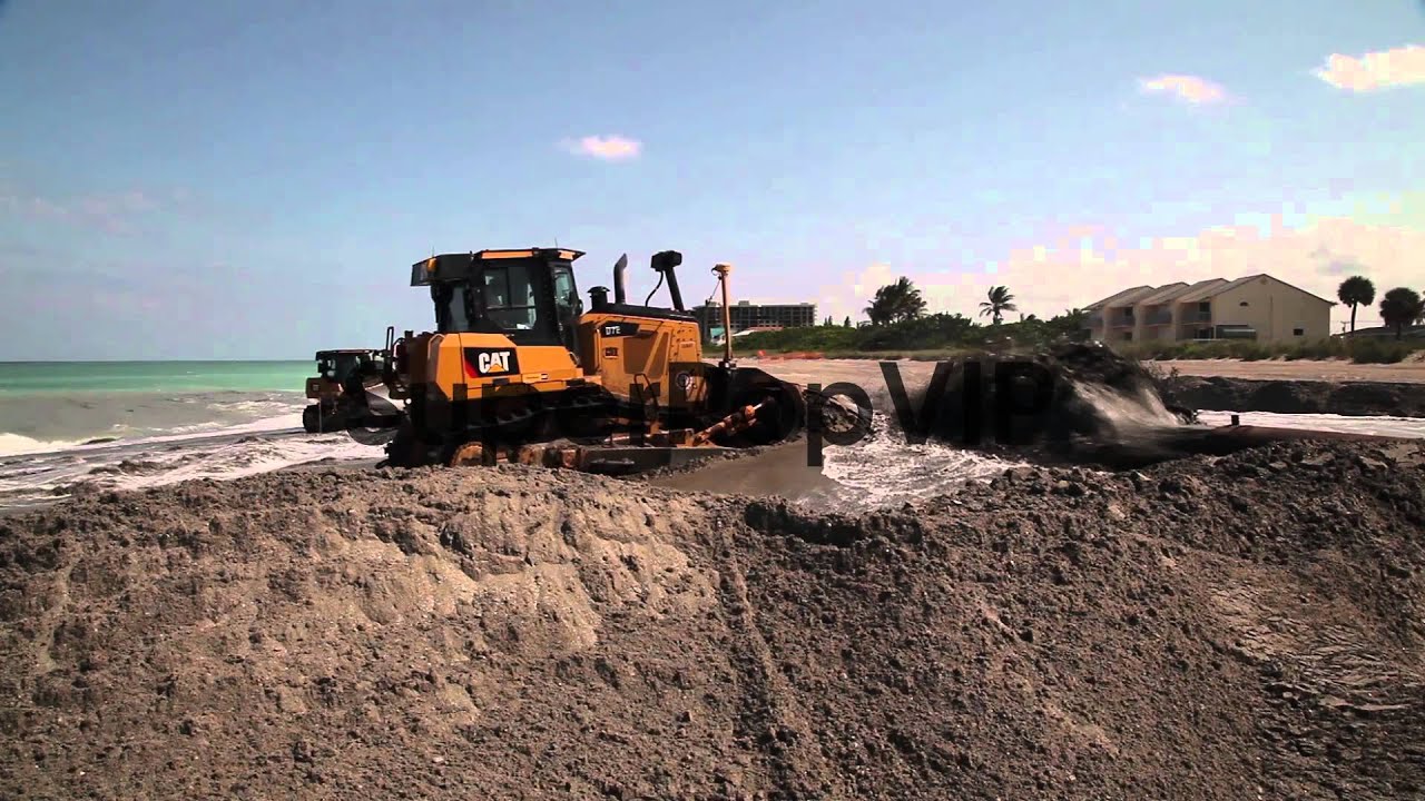 Long shot of bulldozers pushing sand. A bulldozer is used... - YouTube