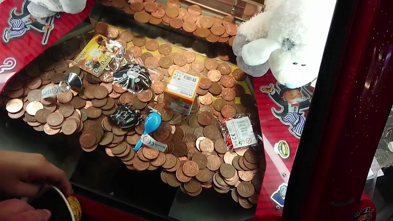 Playing On The Monopoly 2p Coin Pusher In The Arcades - YouTube