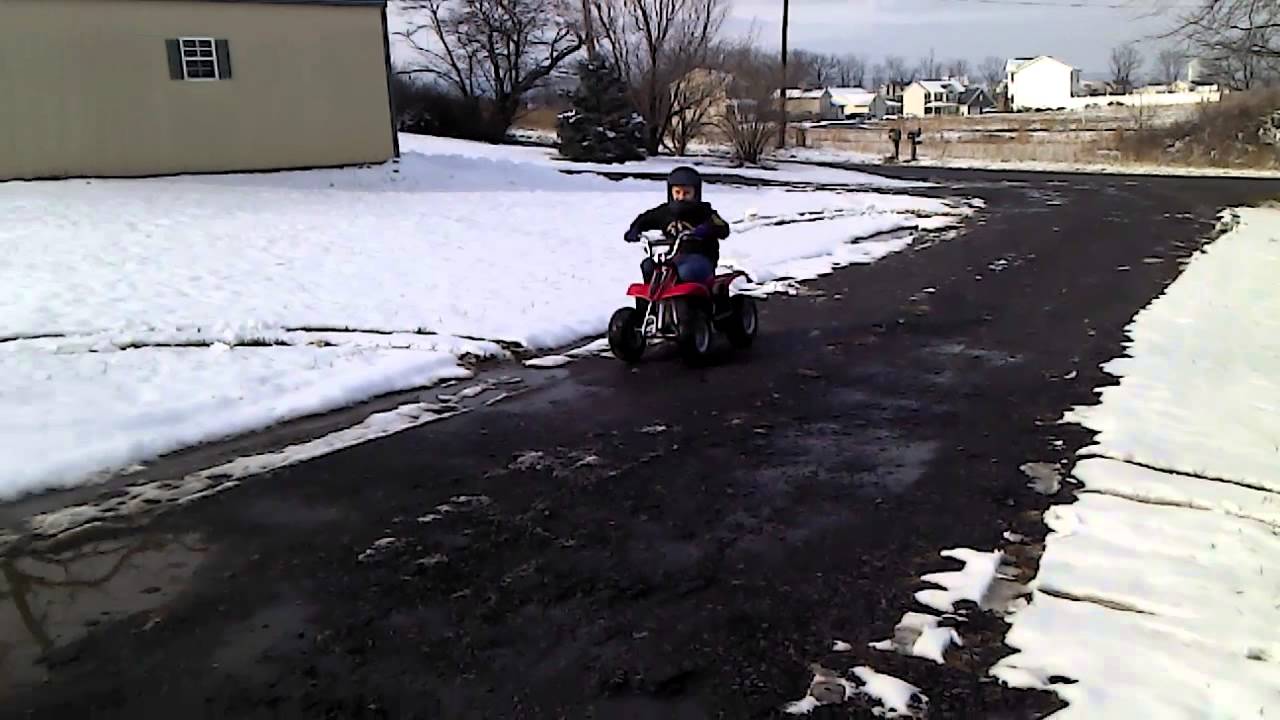 Enjoying his Razor 4 wheeler Santa brought him - YouTube