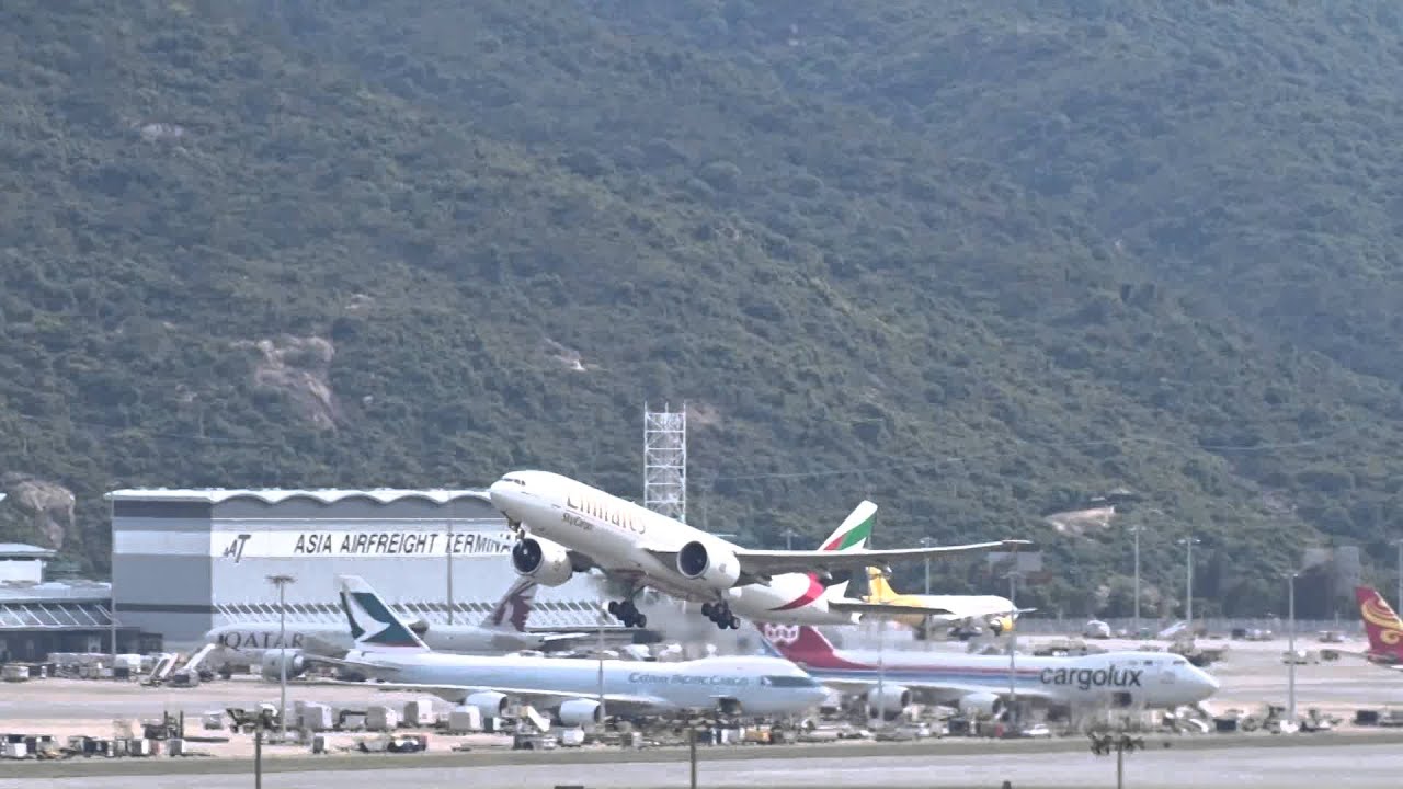 Emirates (EK) B777F taking off on runway 07R of VHHH - YouTube
