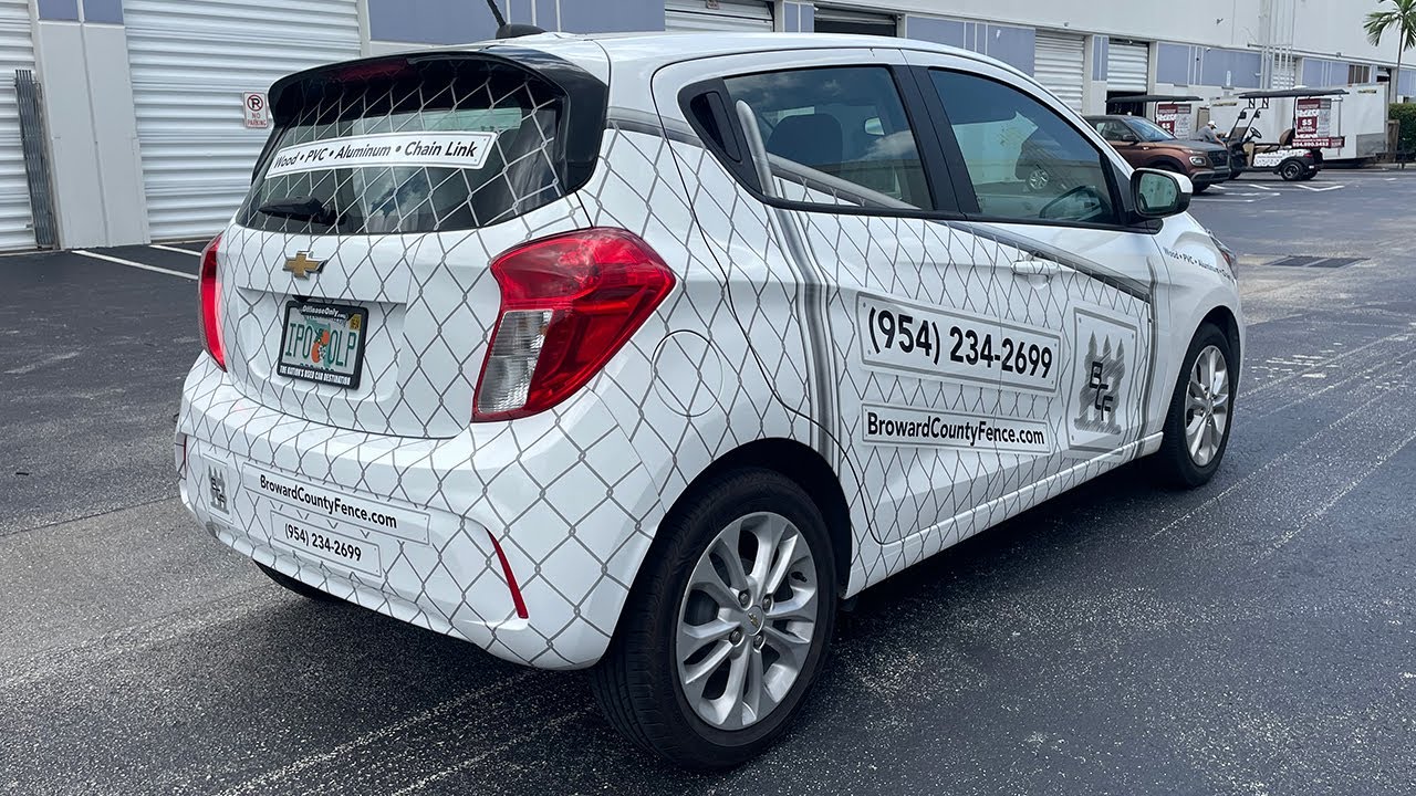 Chevrolet Spark Wrap (Broward County Fence) - Car Wrap Advertising ...