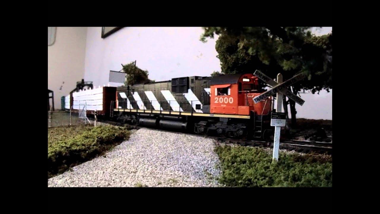 CN C630M lifting a cut of lumber cars - YouTube