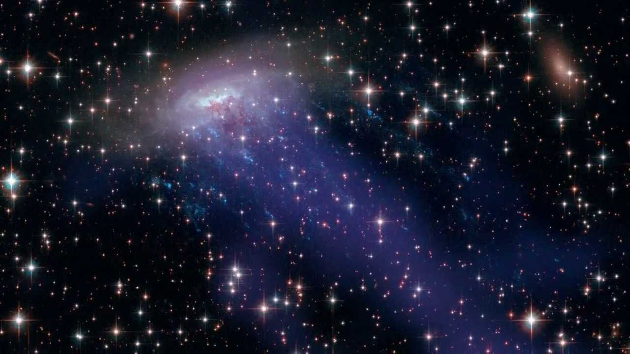 Spiral Galaxy's 'Guts' Blown Out Into Space | Video - YouTube