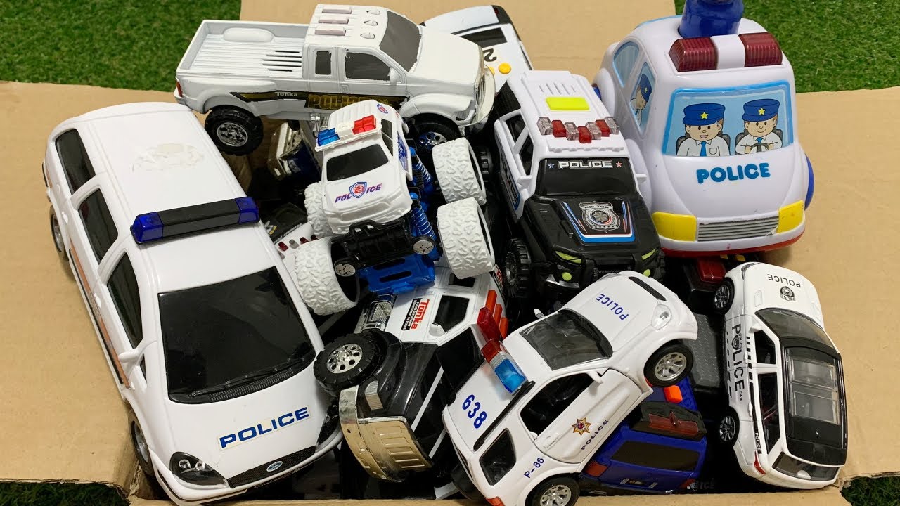 Box Full of Police Cars Checked One by One. Three by Three Emergency ...