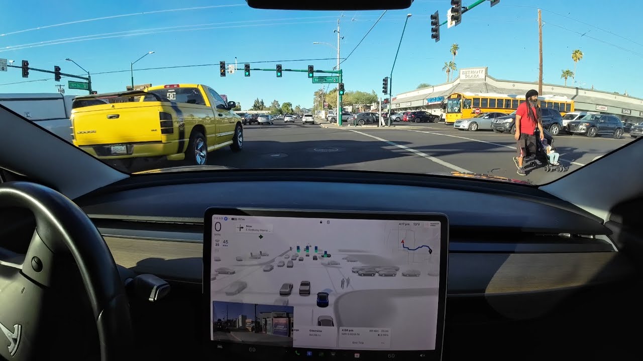 Tesla FSD 12.5.4.1 waits for people in the crosswalk - YouTube