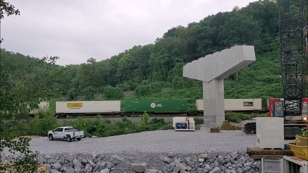 NS 8037 & 9835 cruise past the construction with the southbound stack ...