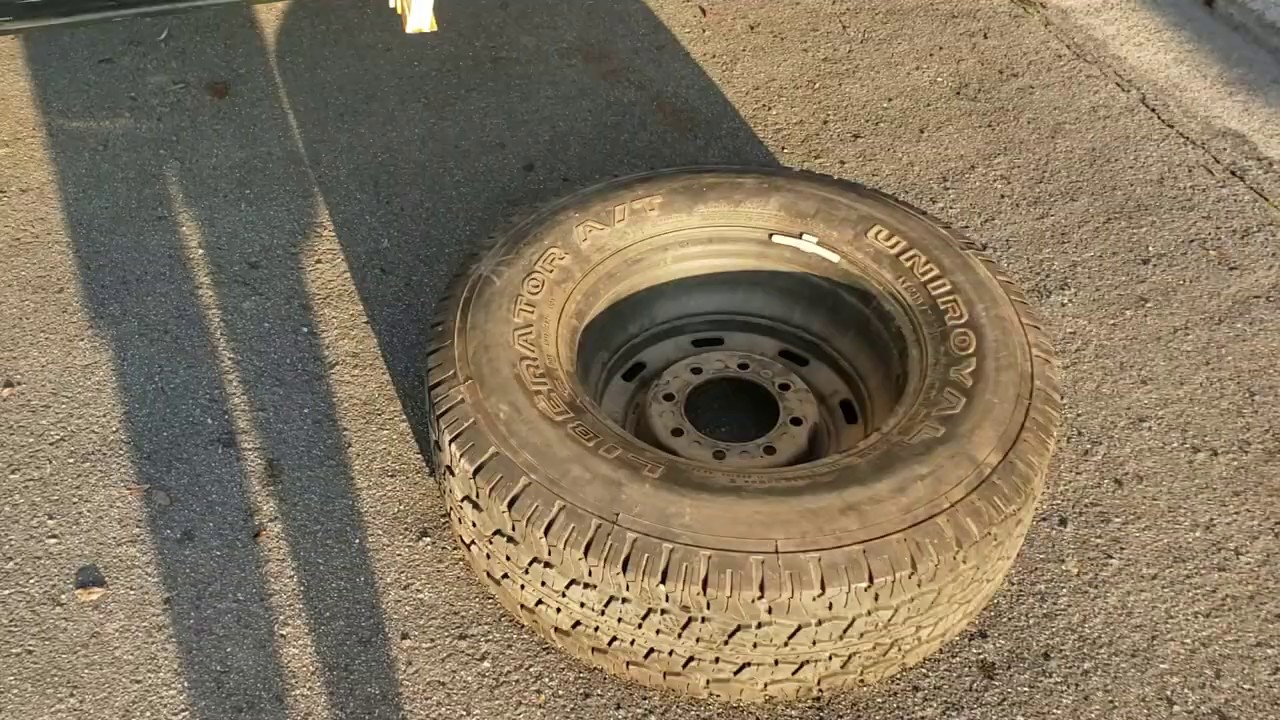 Spare tire hoist relocation and putting back the spare tire. - YouTube