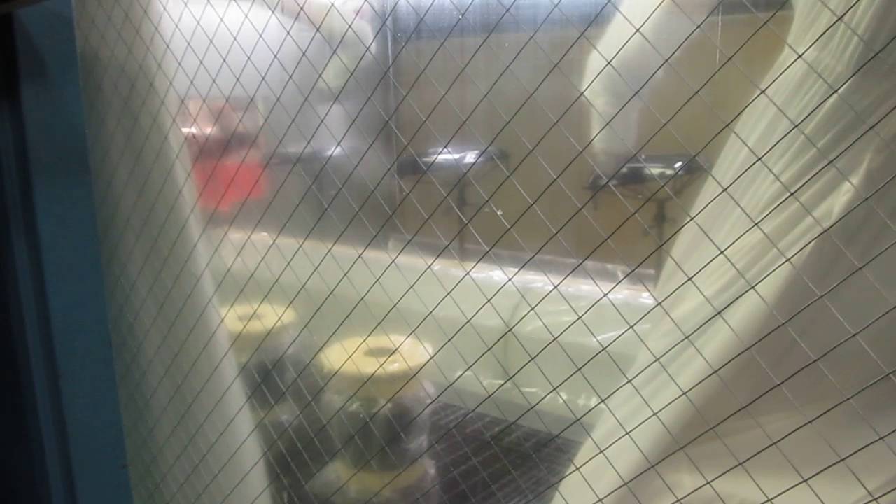 Robot using Bell applicator to spray flat panels - YouTube