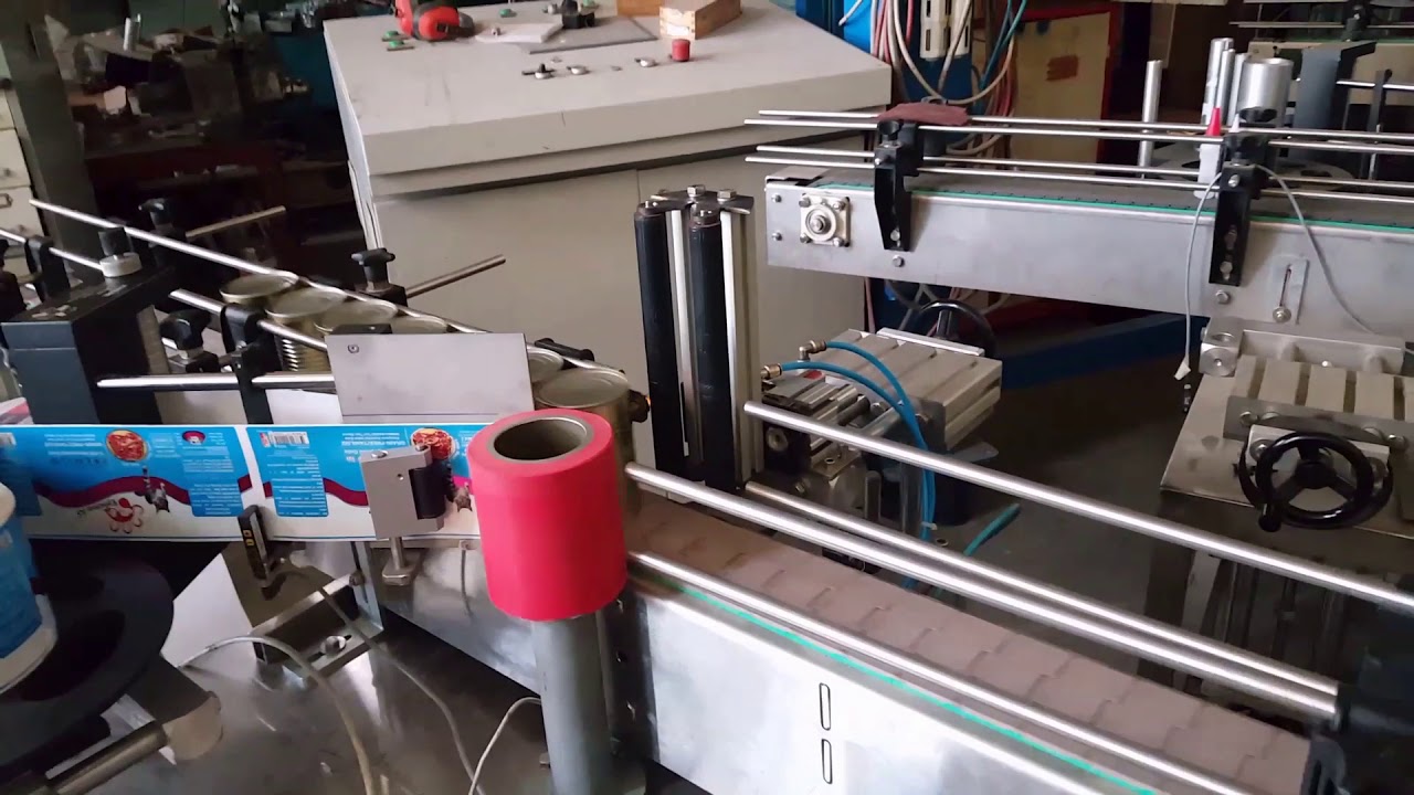 Sticker labeller machine for can bottle - YouTube