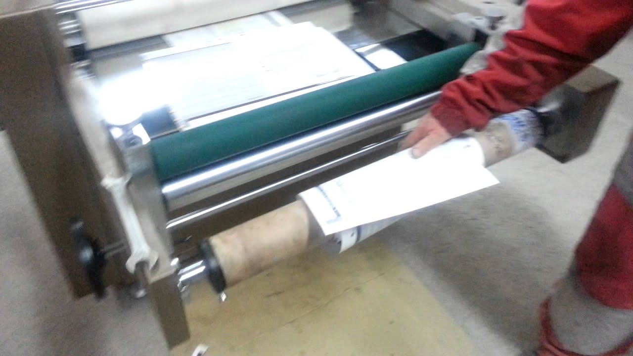 Sheet separation after laminating sheet to roll - YouTube