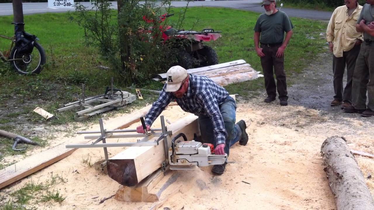Cutting lumber with a chain saw mill. - YouTube