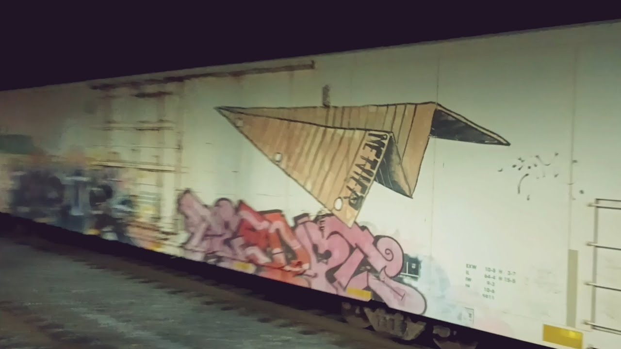CSX M405 with a paper airplane graffiti on a Tropicana refrigerated box ...