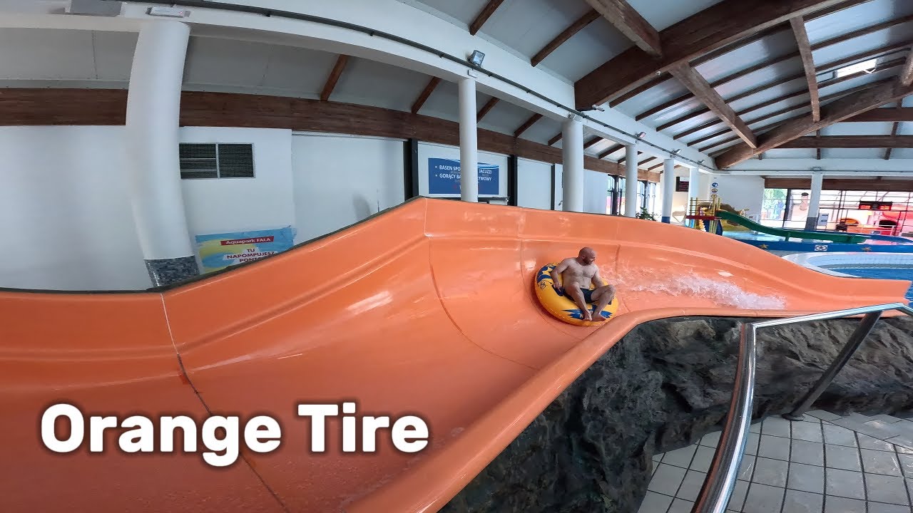 Orange Tire Water Slide in Water Park Aquapark FALA Poland, POV 4k ...