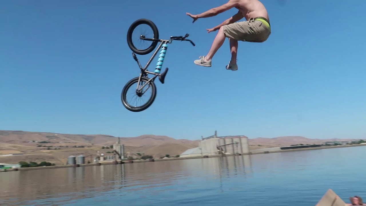 Jumping bikes into the Clearwater River - YouTube