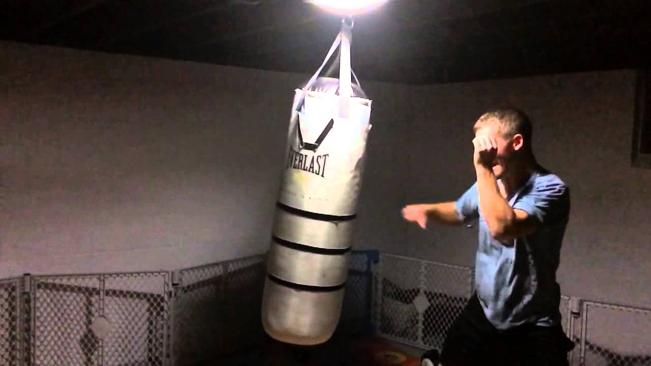 Slow motion heavy bag strikes 120 fps - YouTube