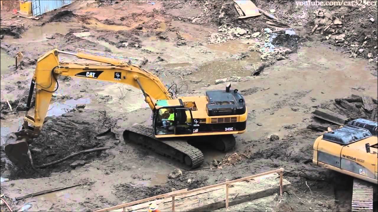 Cat 345CL excavator working - YouTube