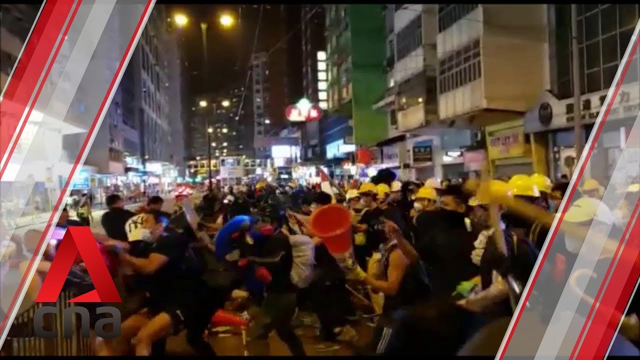 Fight breaks out between group of men with sticks and anti-government ...