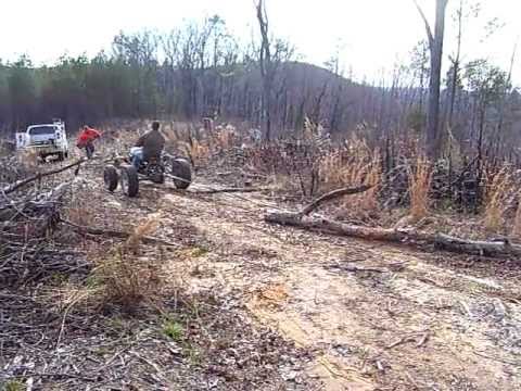Homemade tractor pulling trees! - YouTube