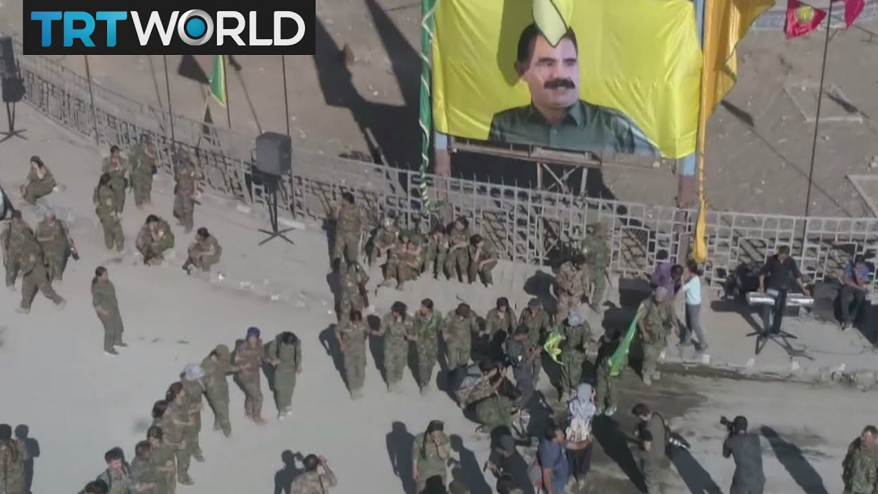 The War in Syria: SDF raises banner in Raqqa showing PKK leader - YouTube