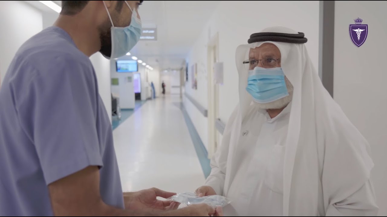 Distributing masks at King Hamad University Hospital - YouTube