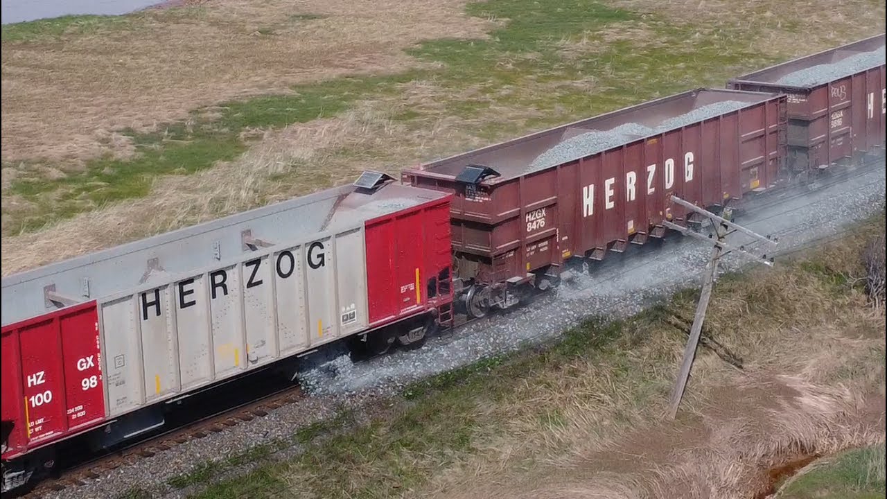 Awesome 4K Aerial View w/zoom! Herzog Ballast Train CN 901 Dumping Ballast at Upper Dorchester ...