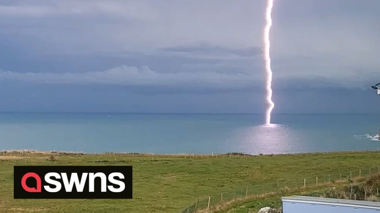 Rare footage shows moment lightning bolt slams into the sea off the ...