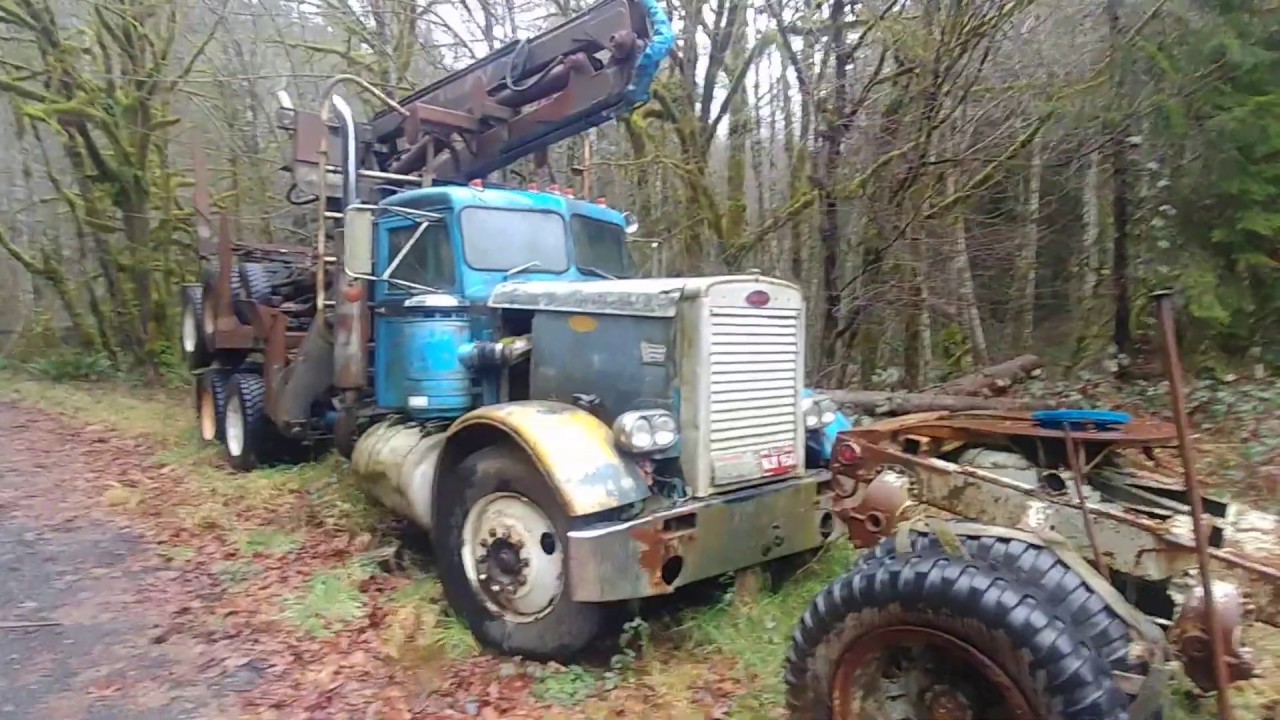 Needle-nose Peterbilt self loader log truck - YouTube