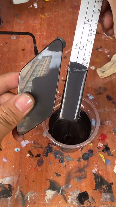 An Audi Q2L in Fierce Stone Black, customized with two cans of hand painted paint, given to fans ...