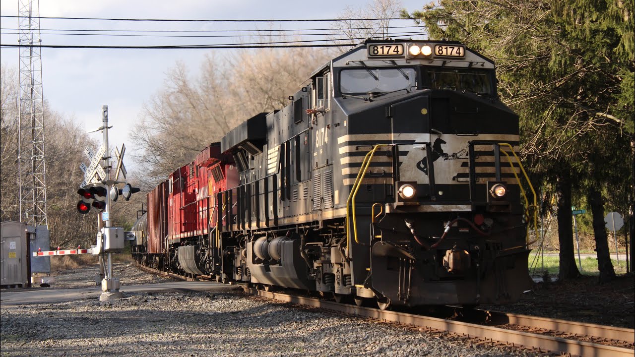 NS 8174 ES44AC Leads NS 64K with a friendly crew and a CP AC4400CWM trailing - YouTube