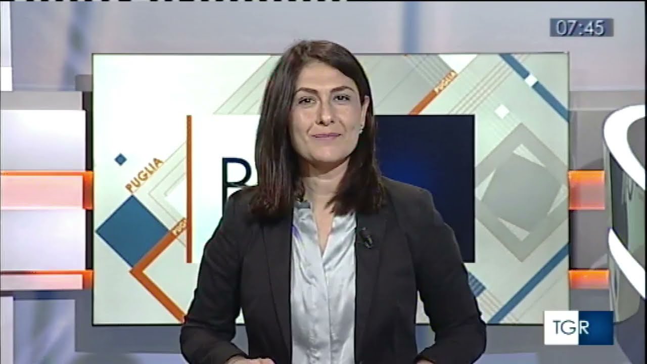 Maria Grazia Lombardi in light blue silk blouse under blazer - YouTube