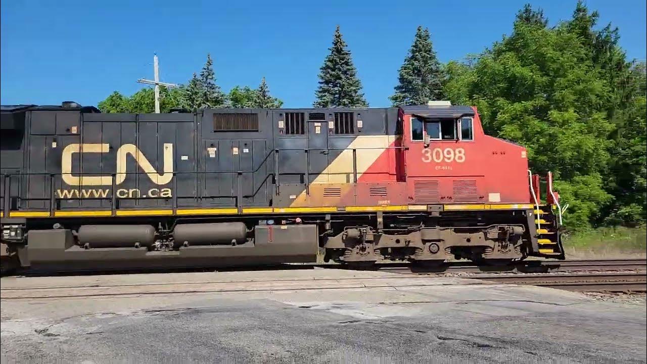 CN 3098, 3957 motivate a freight train with ASPHALT tank cars, Canada hopper East of Vicksburg ...