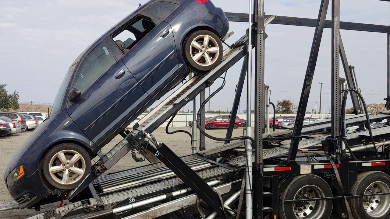 10 car hauler call falls off ramp - YouTube