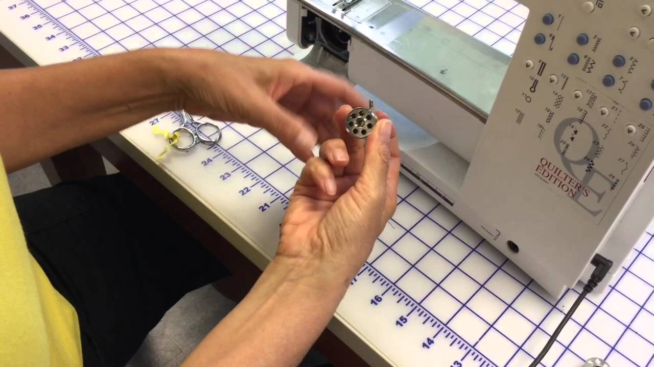 Loading the Bobbin into the Machine - YouTube
