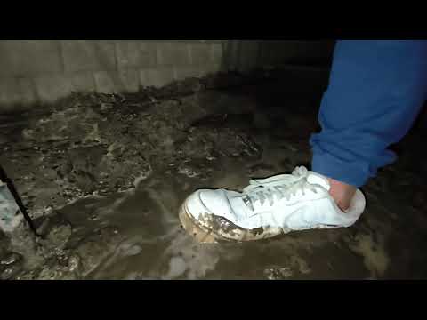 White Nike af1 and ankle socks in the mud