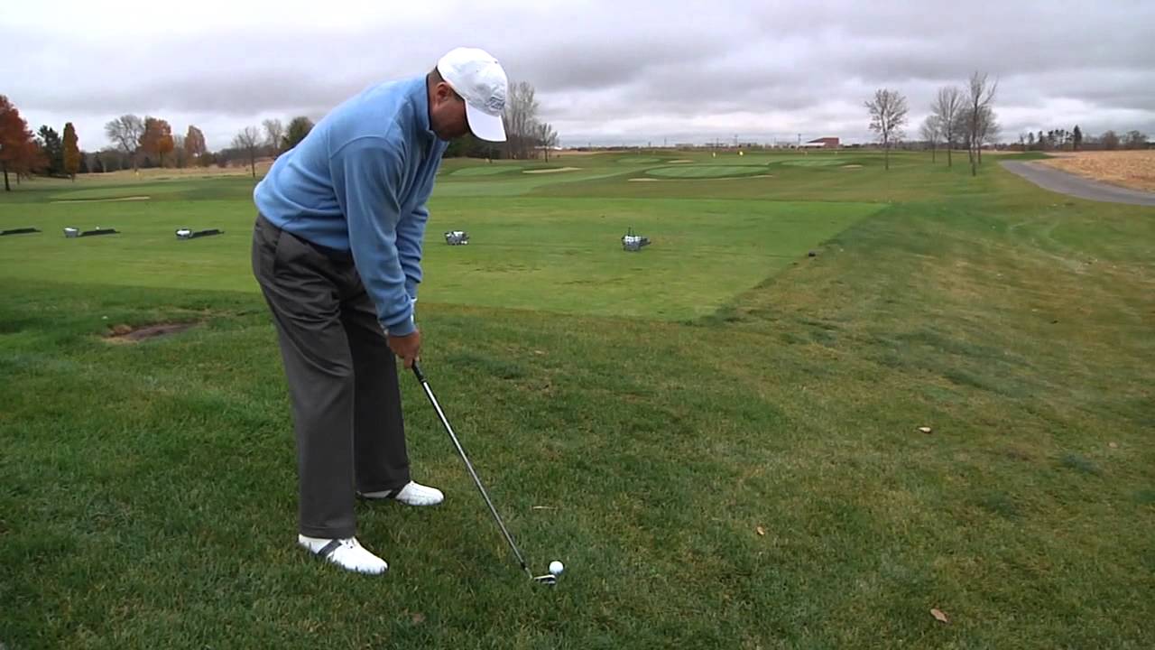 Professional Golf Tip: Sidehill Lie - Ball Below Feet - YouTube