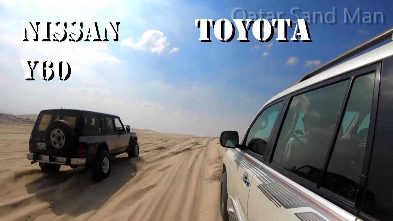 Nissan Patrol Y60 and Toyota Land Cruiser L200 on dunes at Sealine ...